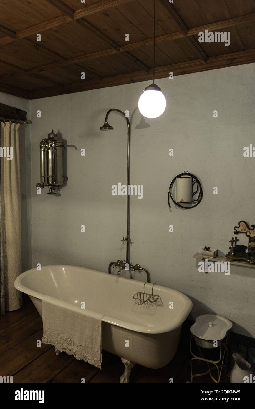 A vintage style bathroom interior design with classic bathtub and ...