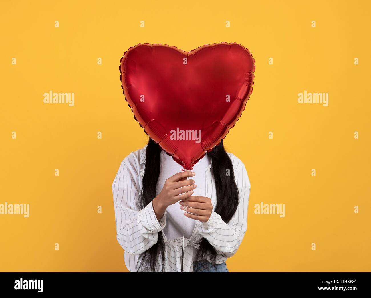 Unrecognizable zoomer african american woman with backpack covers her ...