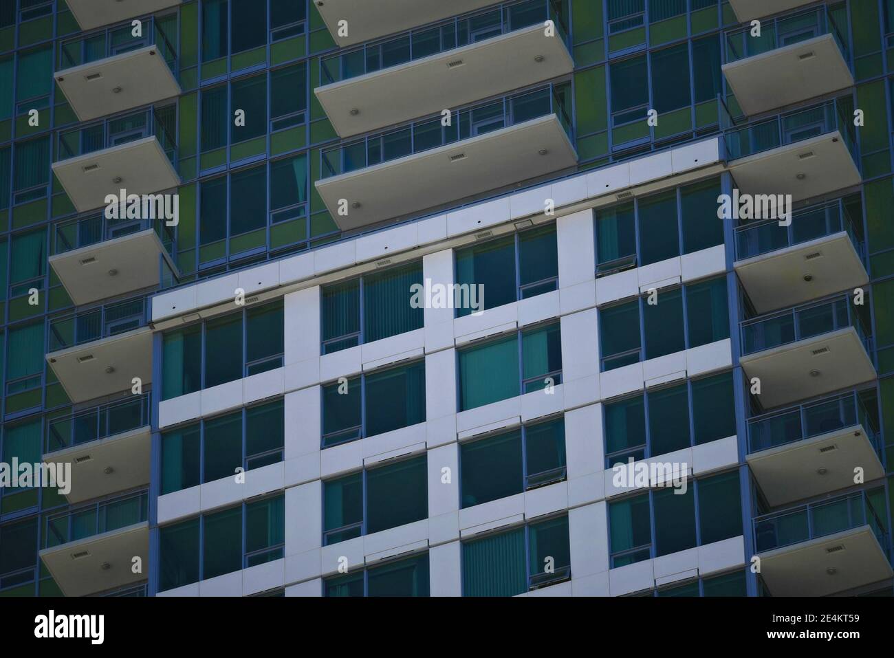 Residential high-rise building exterior with a concrete and glass ...