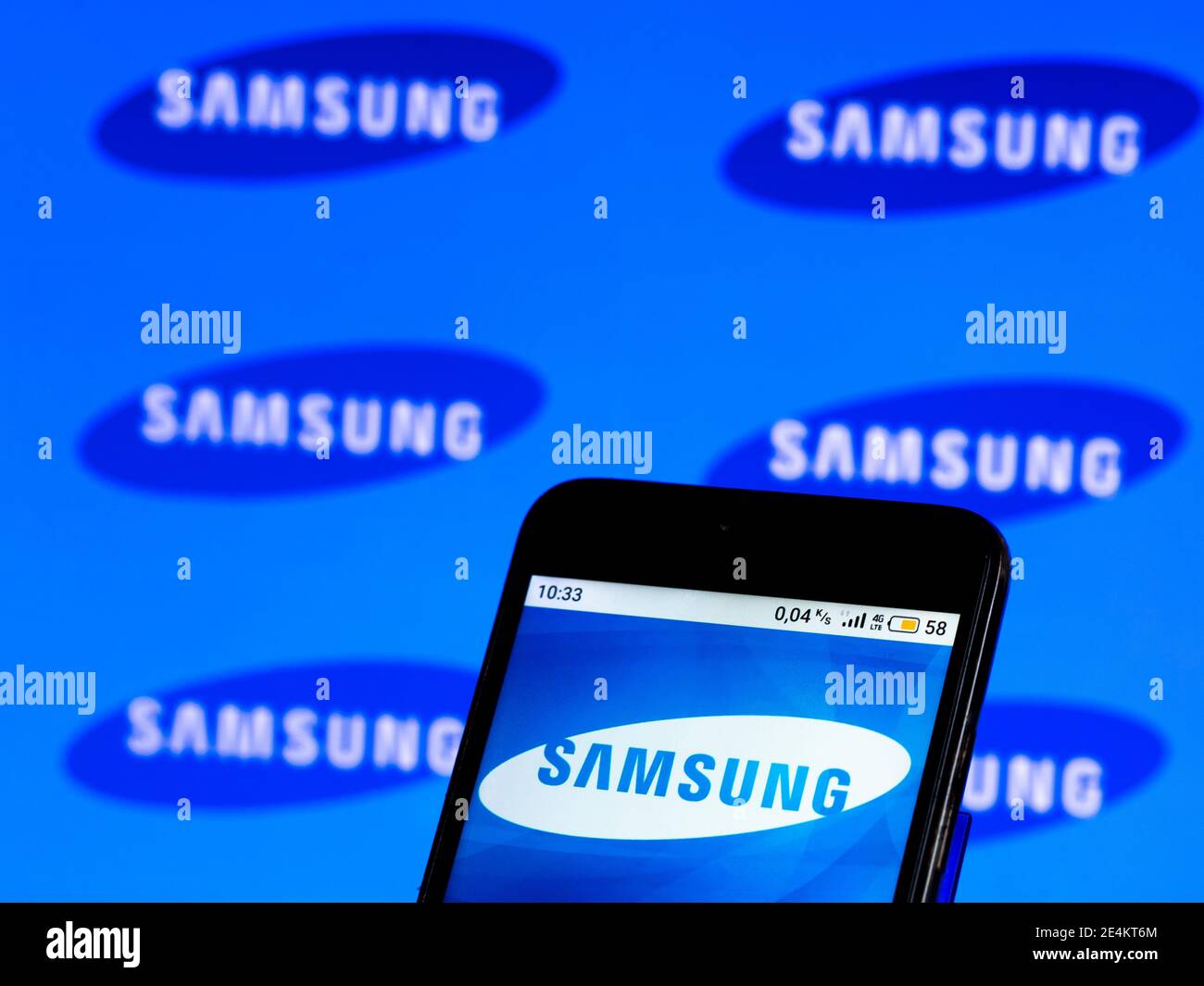 In this photo illustration, a Samsung logo seen displayed on smartphone ...