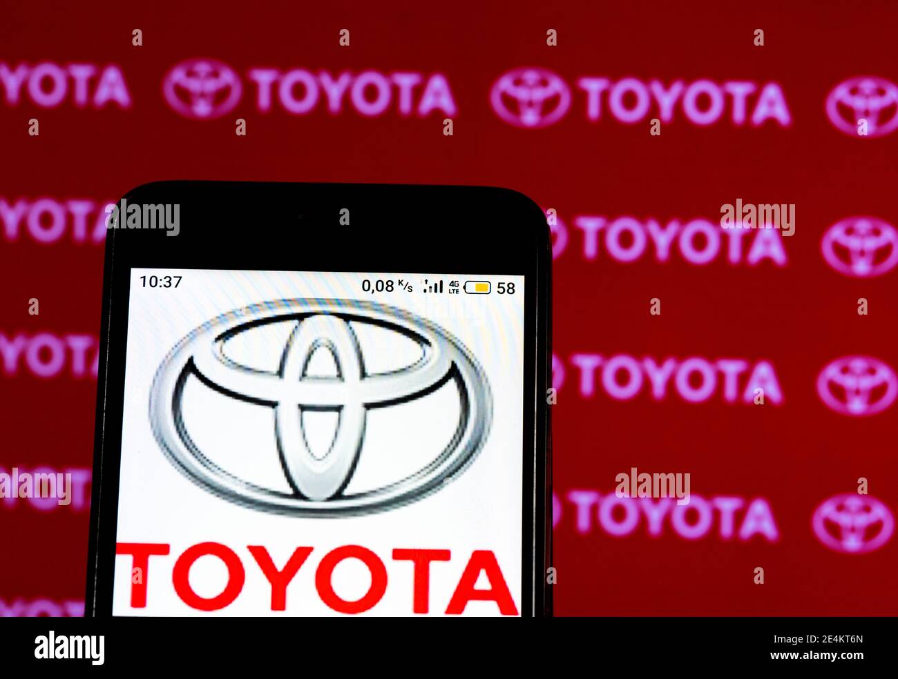 In this photo illustration, a Toyota logo seen displayed on smartphone ...