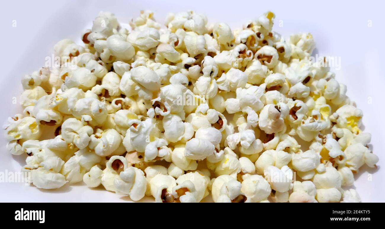 Heap of delicious popcorn, isolated on white background. Scattered ...