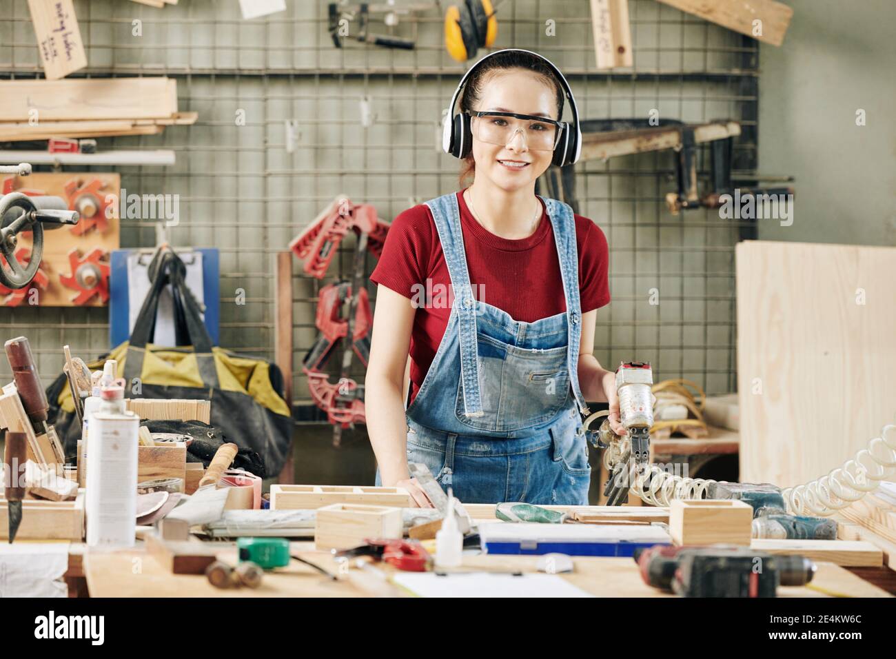 Carpenter using pneumatic stapler Stock Photo - Alamy