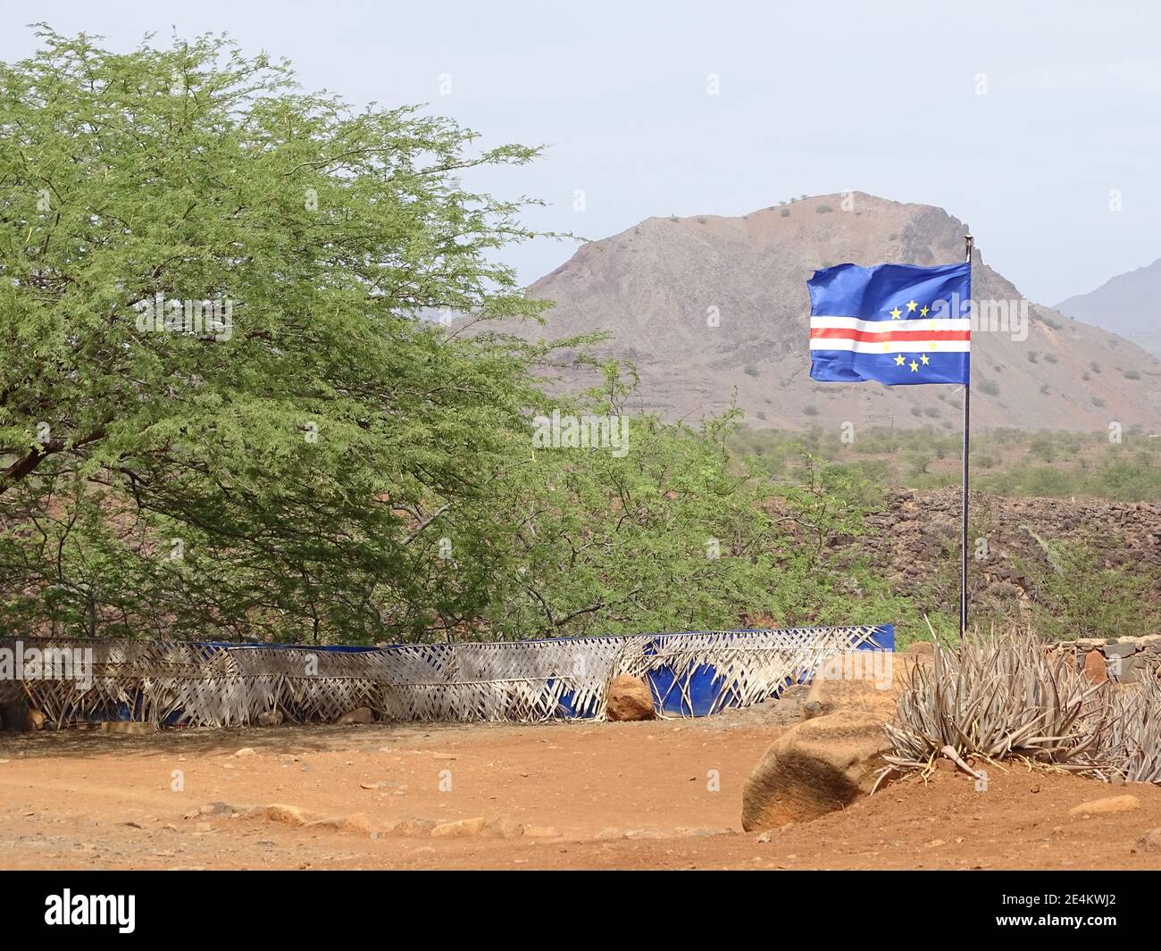 Cape Verde flag, with mountain landscape in background Stock Photo - Alamy