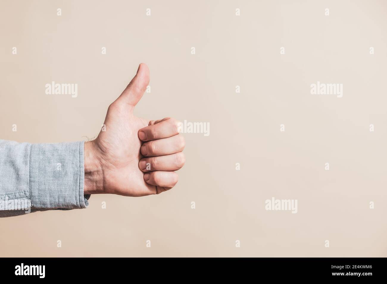 Close up image of male hand showing thumb up Stock Photo - Alamy