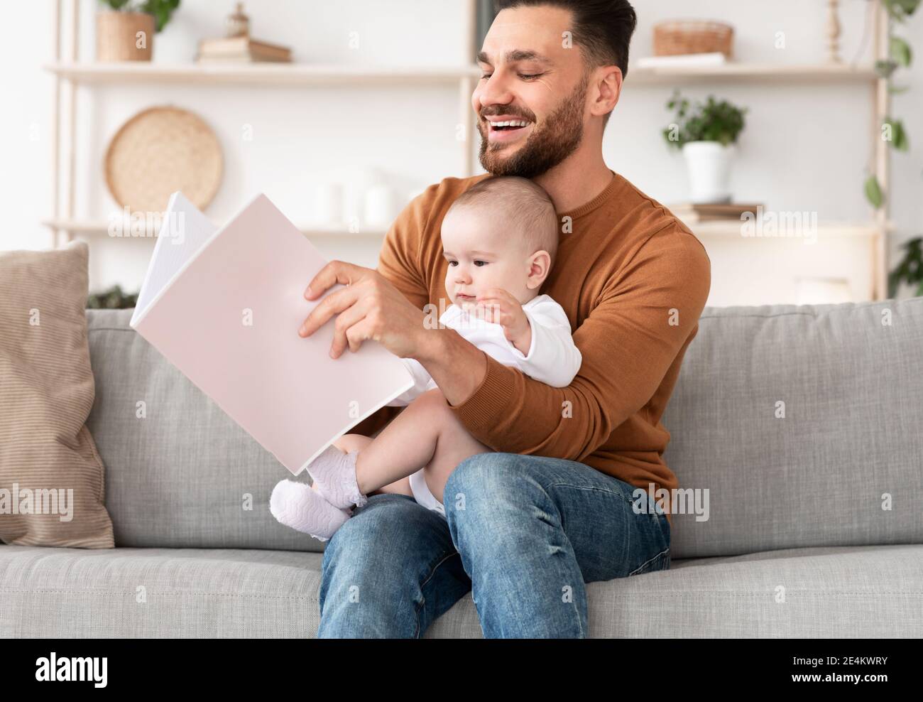 Father reading to baby hi-res stock photography and images - Alamy