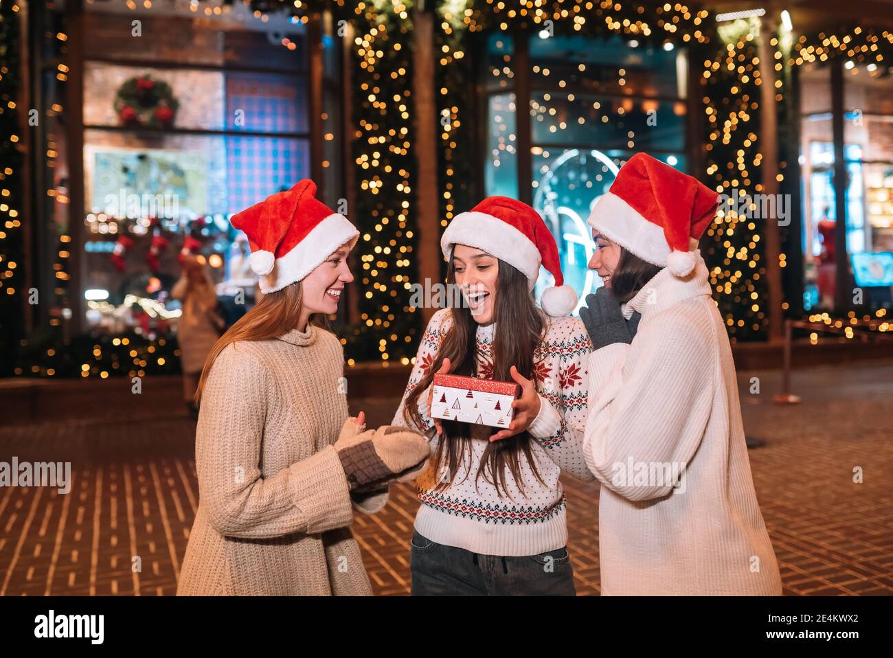 Portrait of happy cute young group of friends hugging each other Stock ...