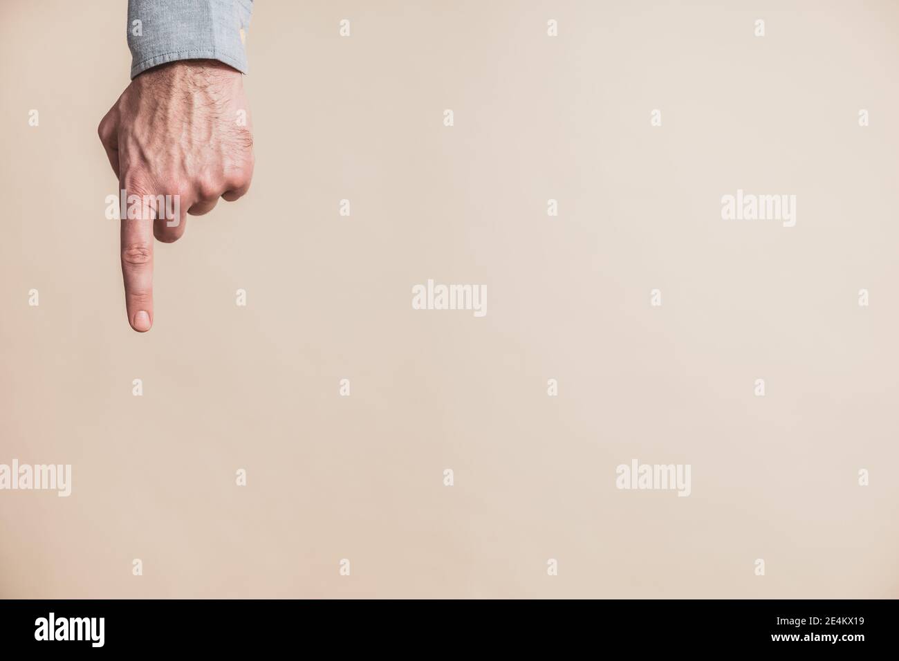 Hand pointing down touching hi-res stock photography and images - Alamy
