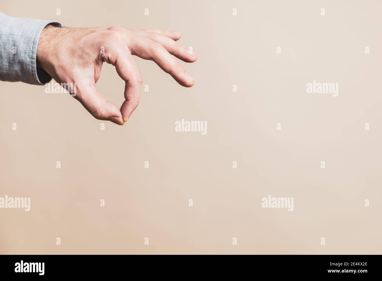 Gripping male hand gesture hi-res stock photography and images - Alamy