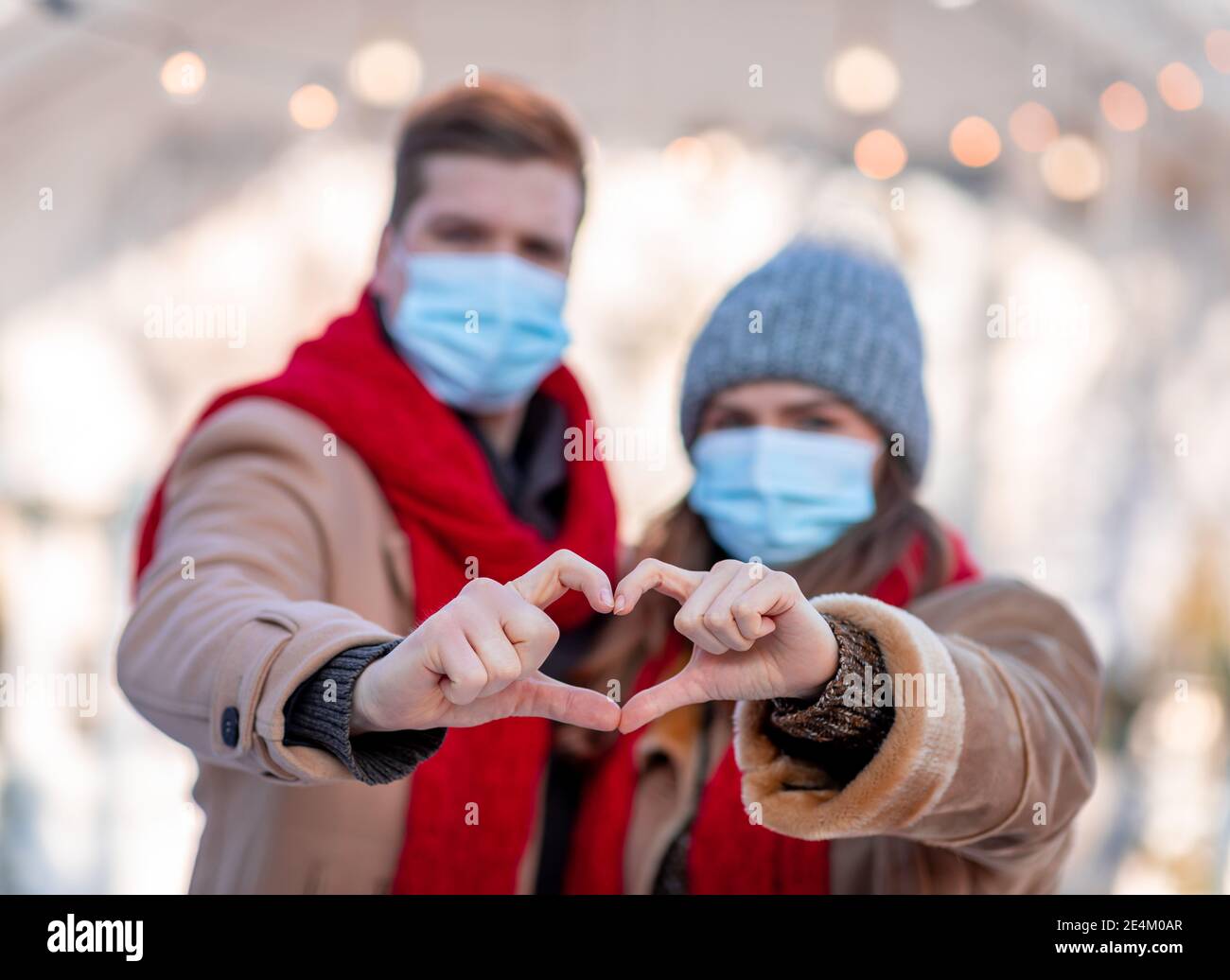 Heart shape sign made by man and woman hands Stock Photo - Alamy