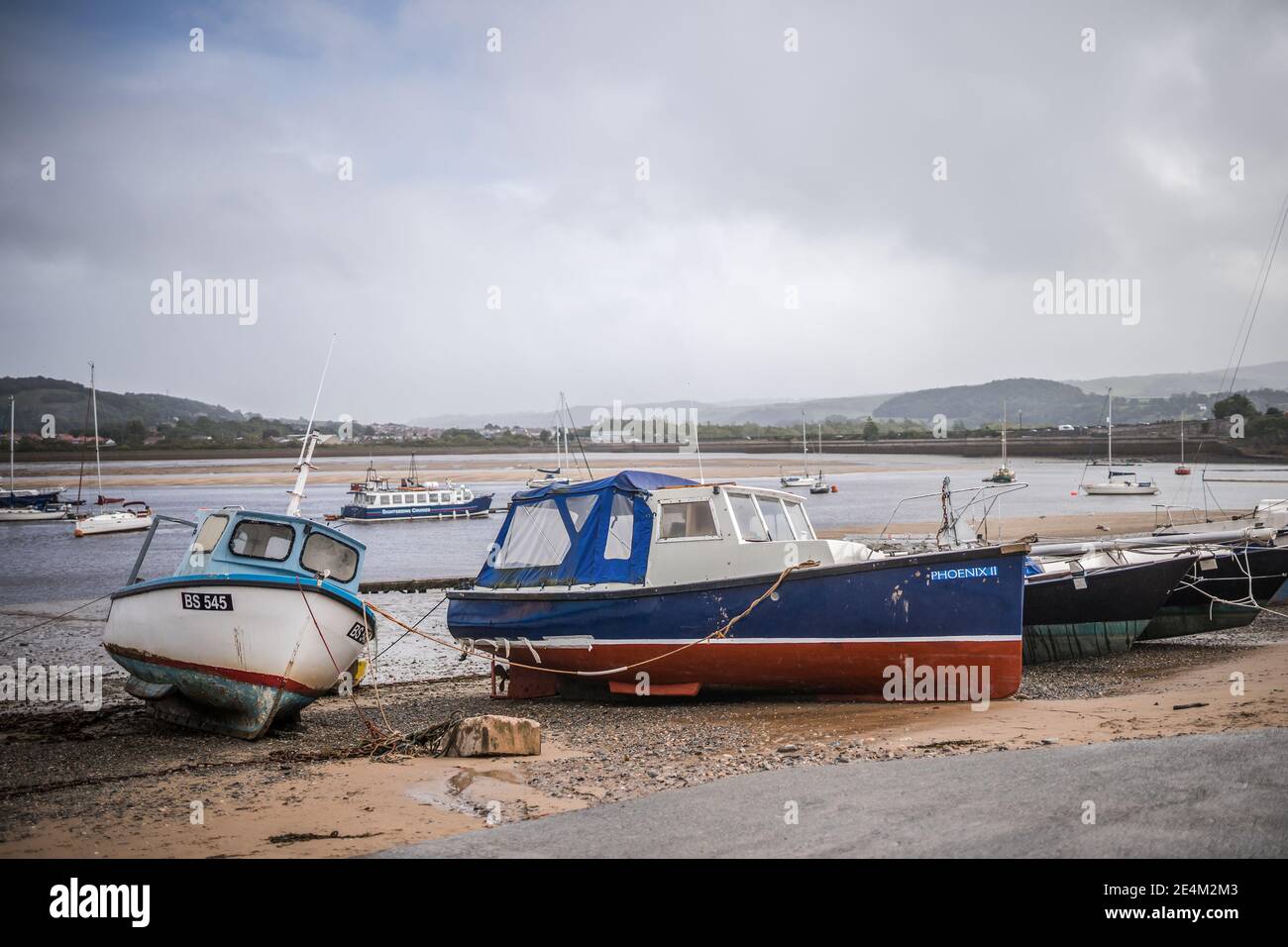Boats during low tide on English seaside harbour at coast in England ...