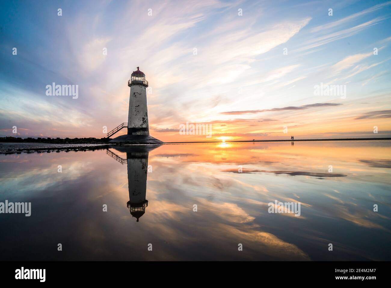 Lighthouse standing in pool of water stunning sunset sunrise reflection ...