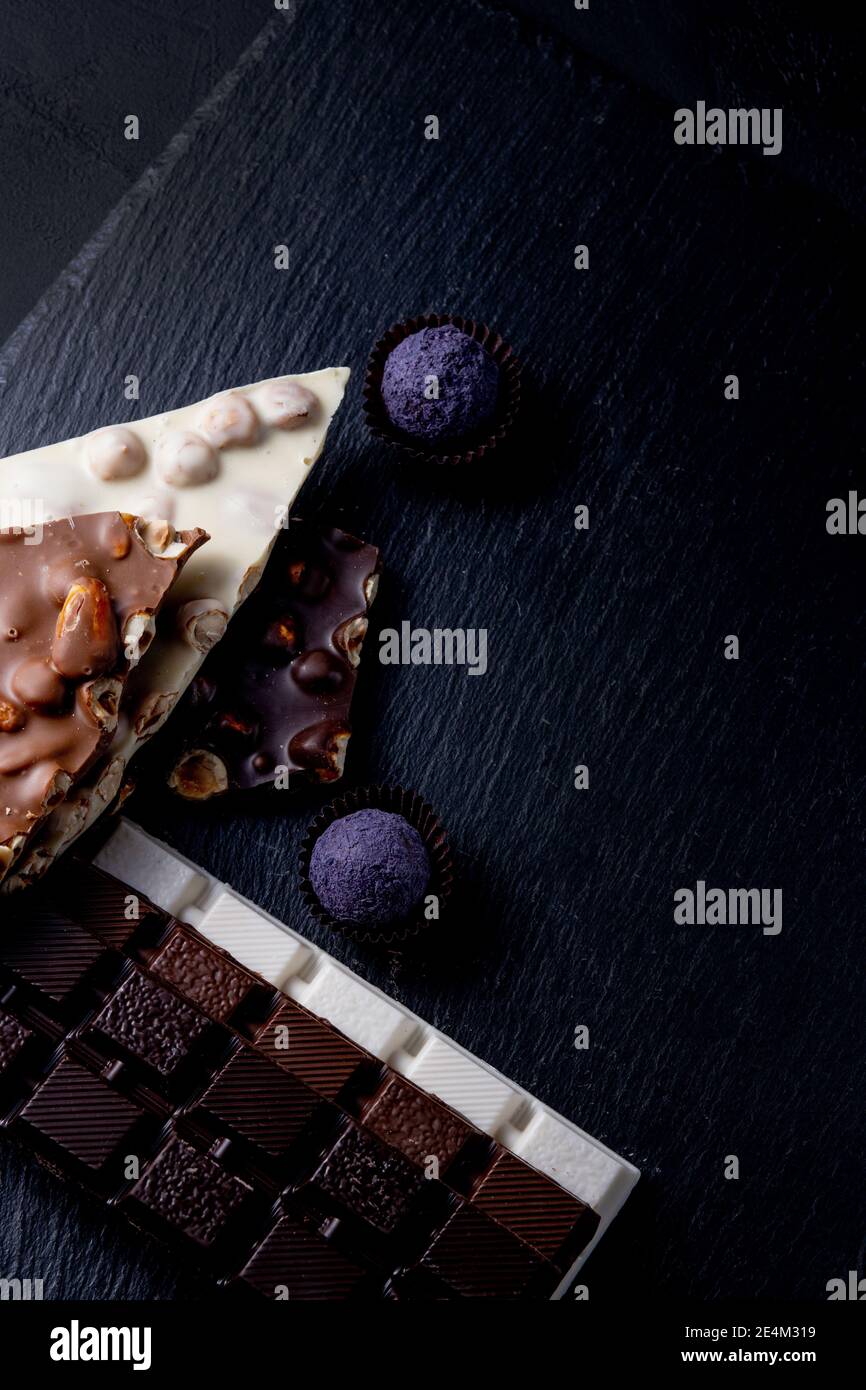 Three types of chocolate - black, milk and white with luxury handmade ...