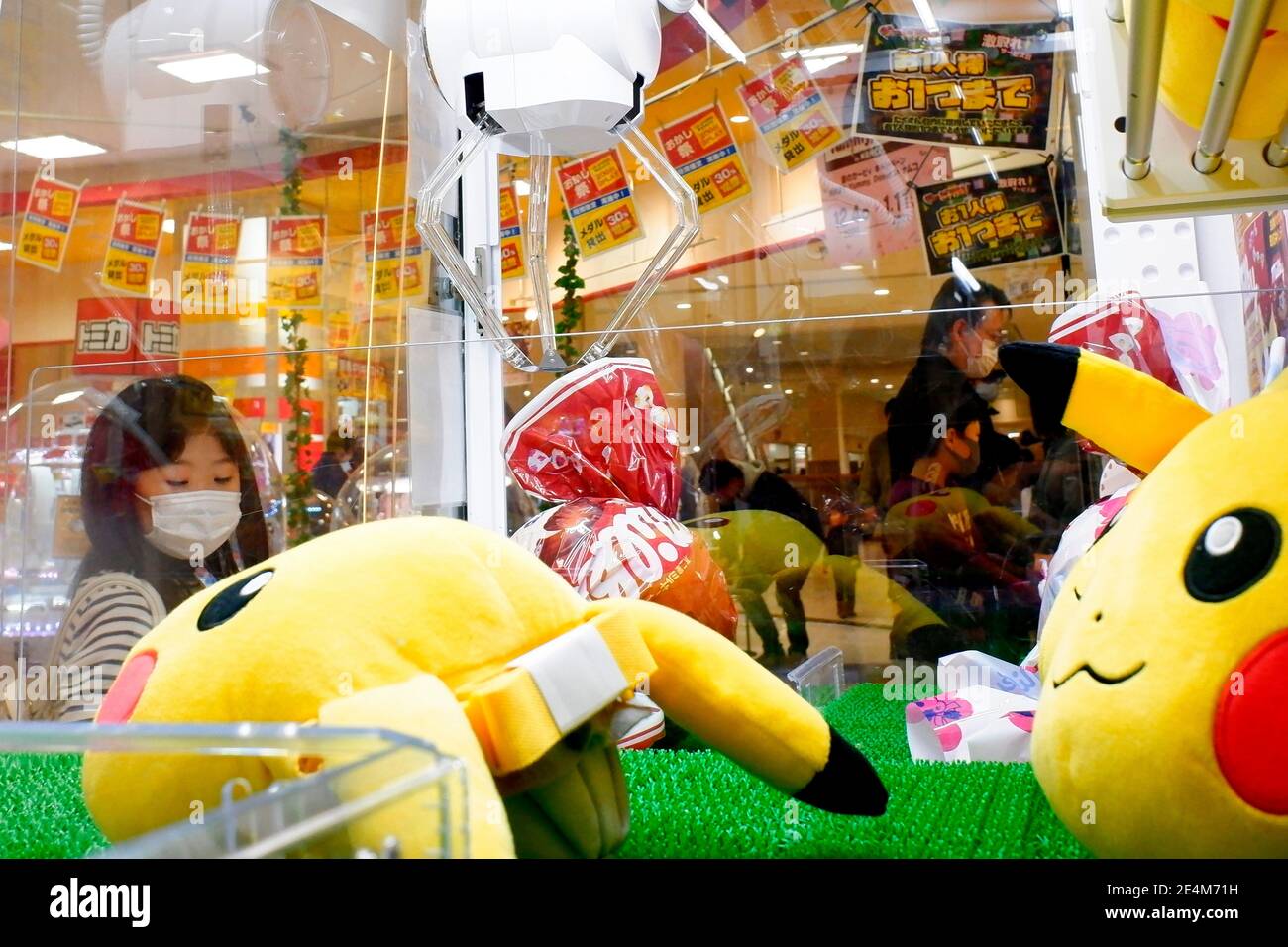 People shopping at AEON STYLE while wearing face masks as a preventive ...