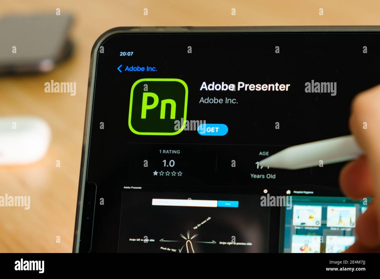 Adobe Presenter logo shown by apple pencil on the iPad Pro tablet ...