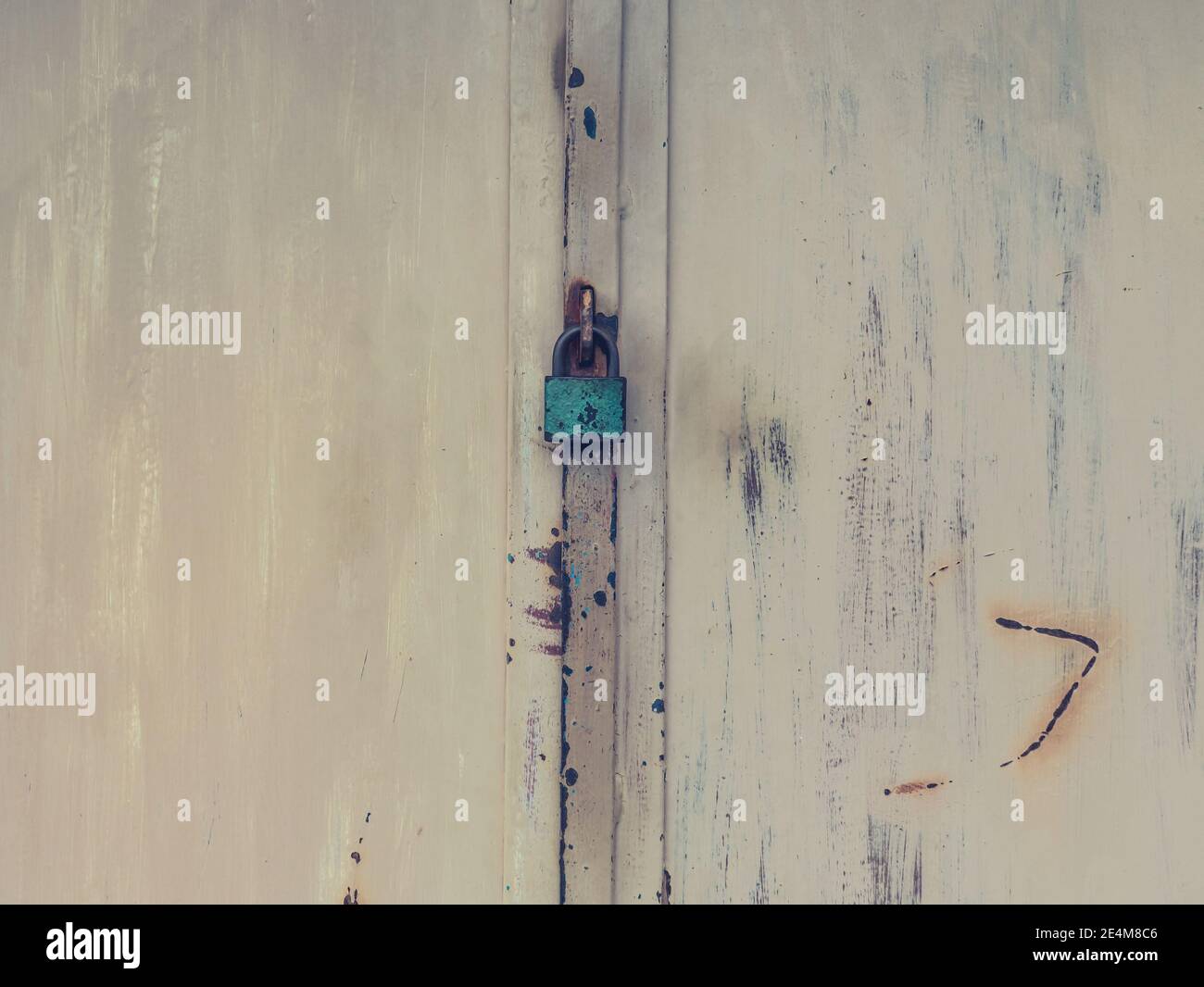 Detail of Grunge Old Door with obsolete yellow green paint. Rusty marks ...