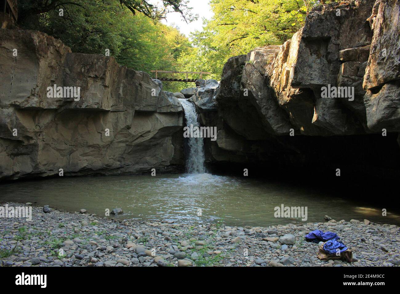 A beautiful waterfall among the magnificent rocks Stock Photo - Alamy
