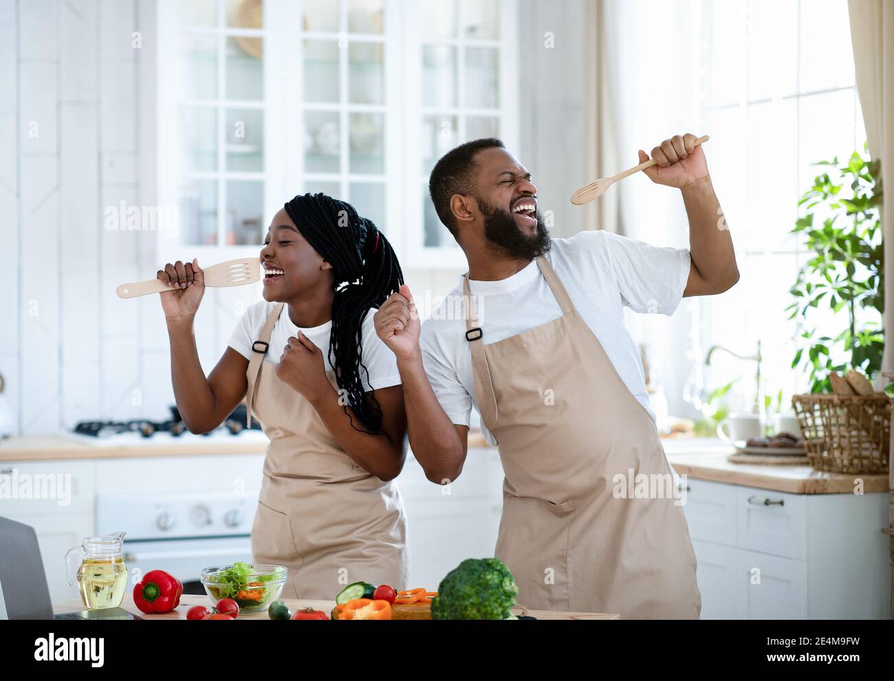 Kitchen Concert. Cheerful Black Couple Having Fun While Cooking ...