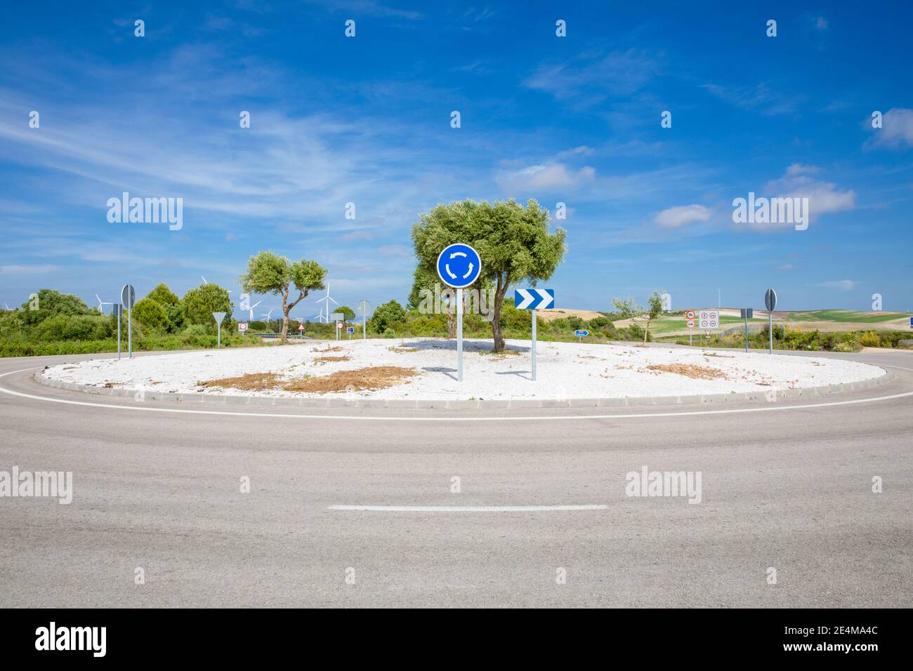 blue roundabout traffic signal in lonely rural road in of Spain, Europe ...