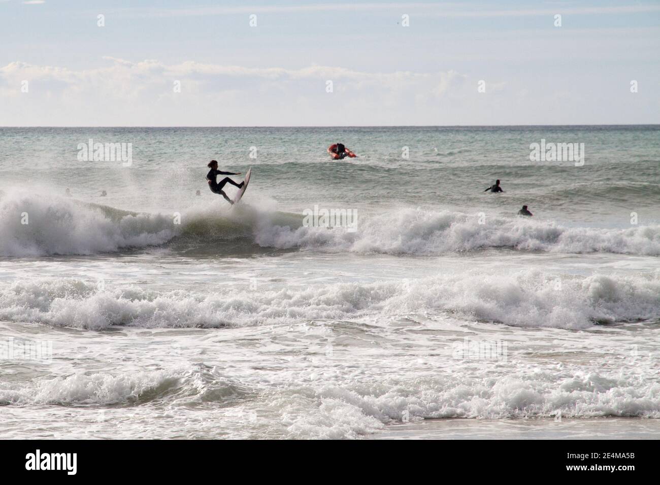 Surfer surfing wave jumping on surf board. Mallorca Spain Stock Photo ...