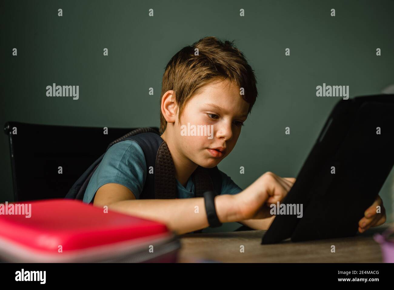 School boy playing tablet at home, growing up with technology Stock ...