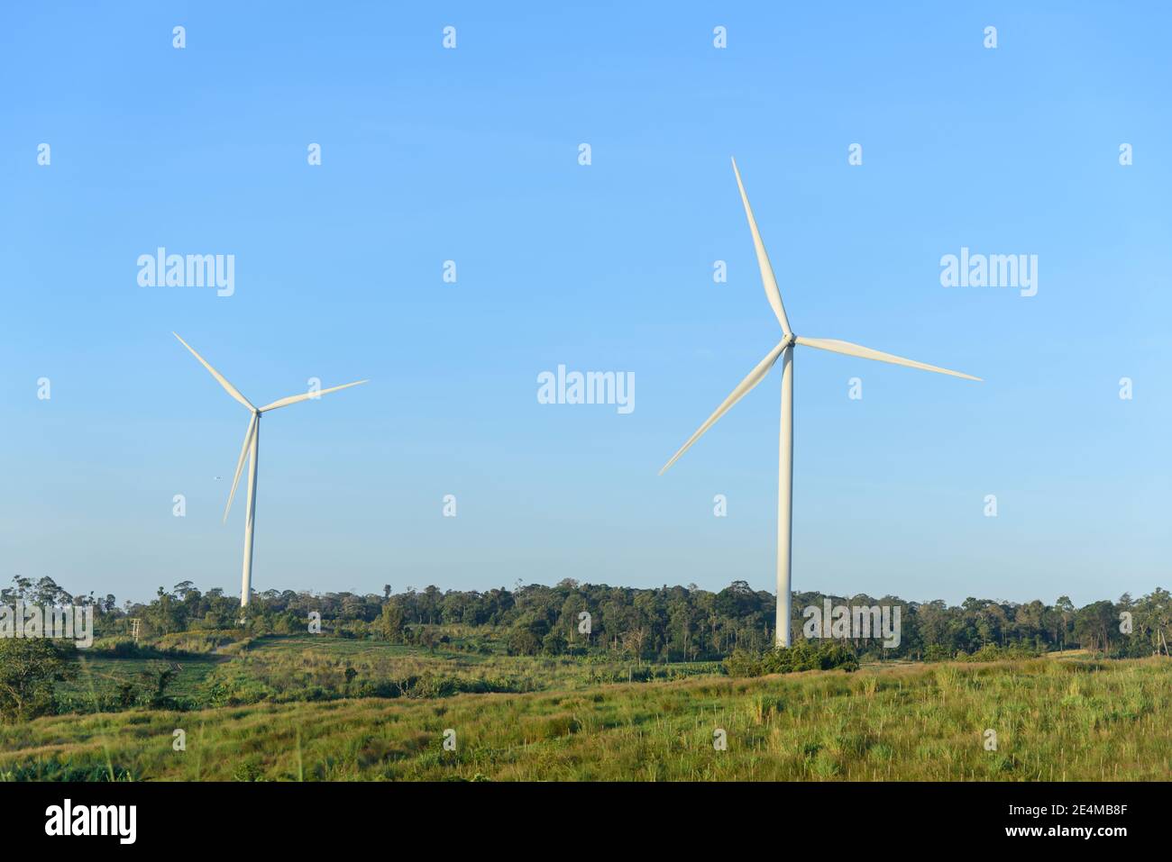 wind turbines park for make the electric power from wind in sunset time ...