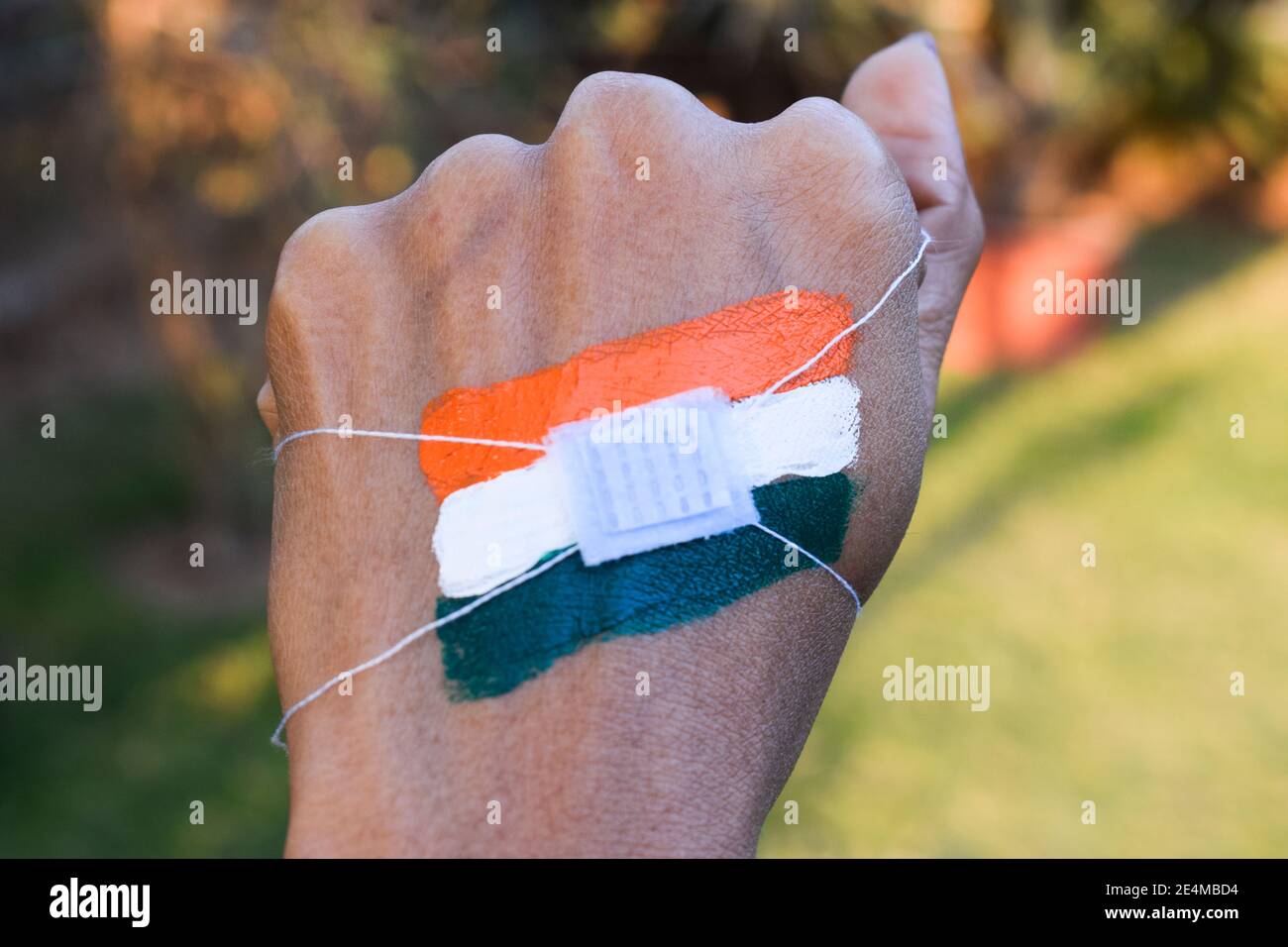 Indian flag tattoo of tri colour painted on person's hand cheering and ...