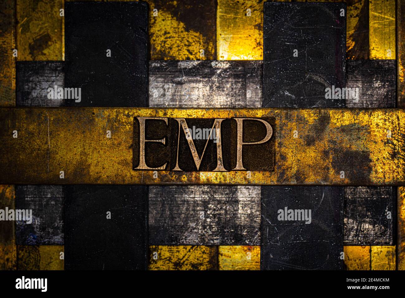 EMP text on vintage textured grunge copper and gold background Stock ...