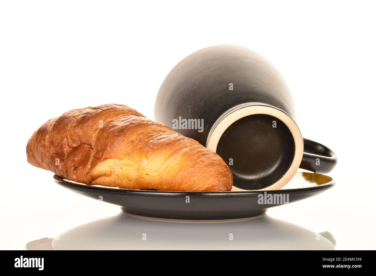 One whole fragrant sweet fresh crunchy croissant with ceramic plate and ...