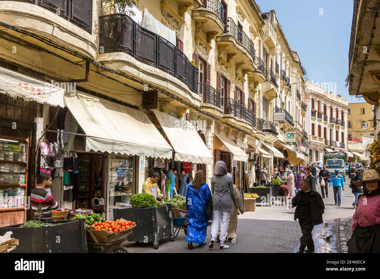 Shoppers walking along busy commercial street in the heart of Tangier ...