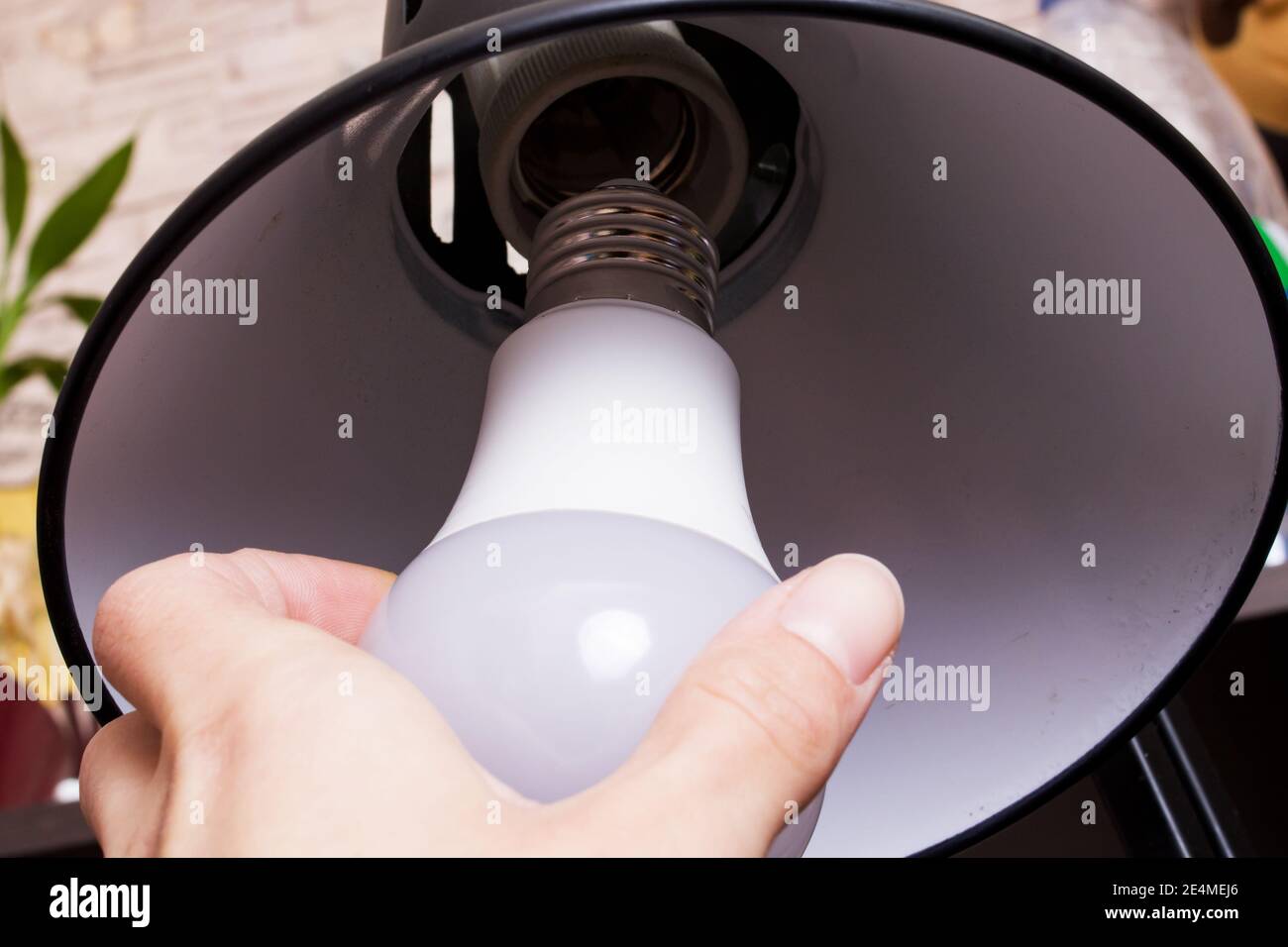 Person twists screw in electric hi-res stock photography and images - Alamy