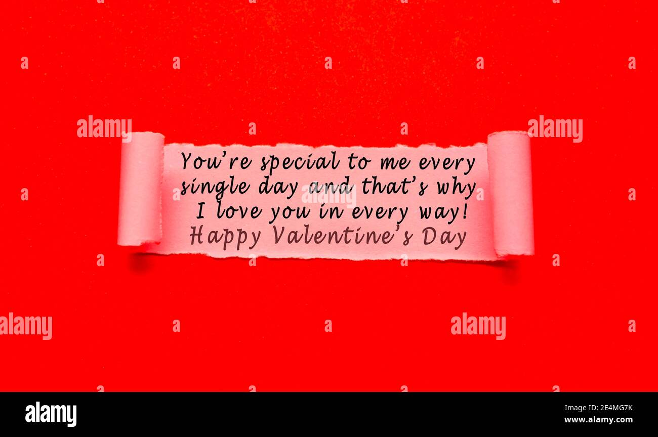 Text label on torn paper with red paper background Stock Photo - Alamy