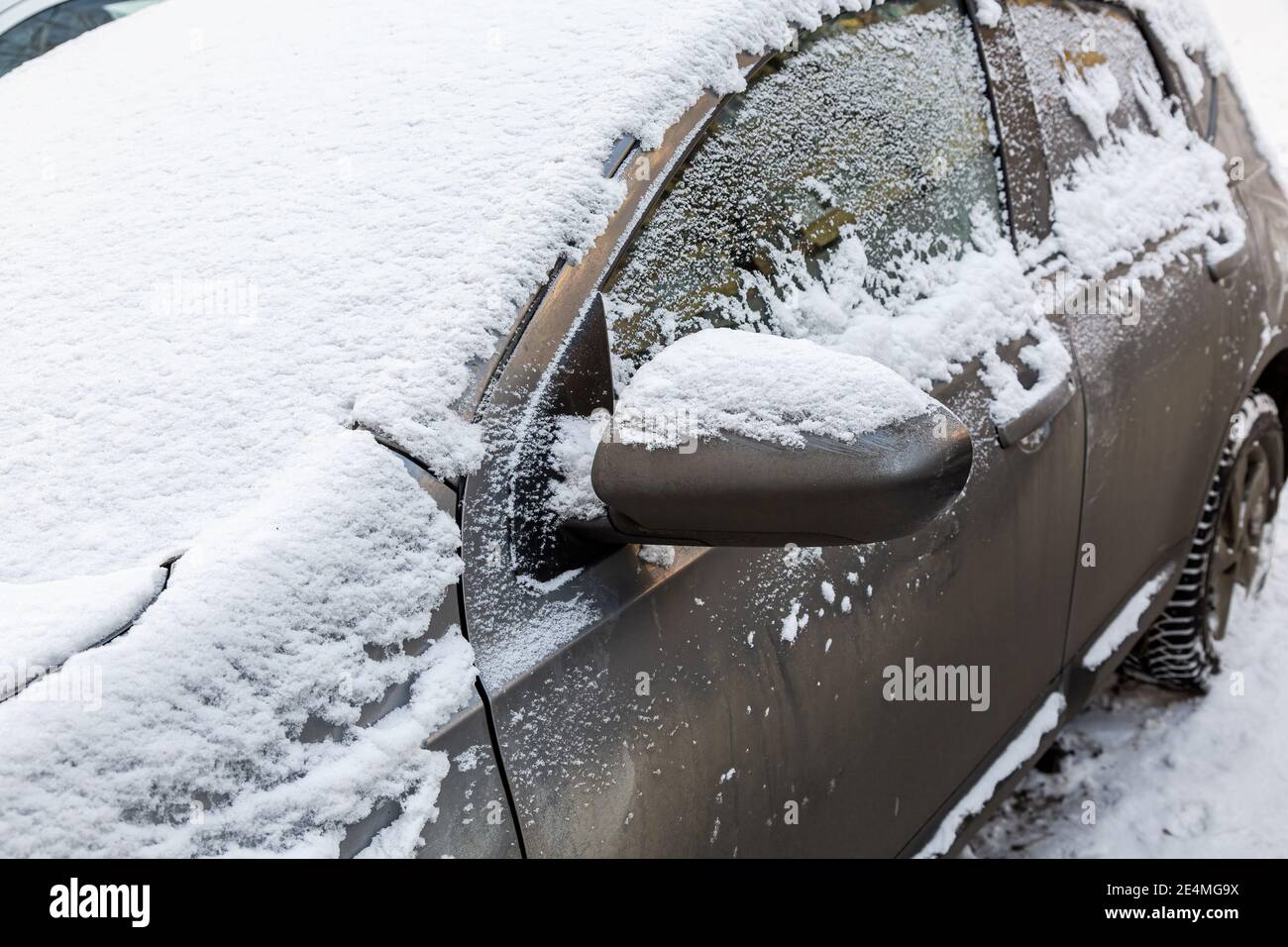 Car under the snow in winter time Stock Photo - Alamy