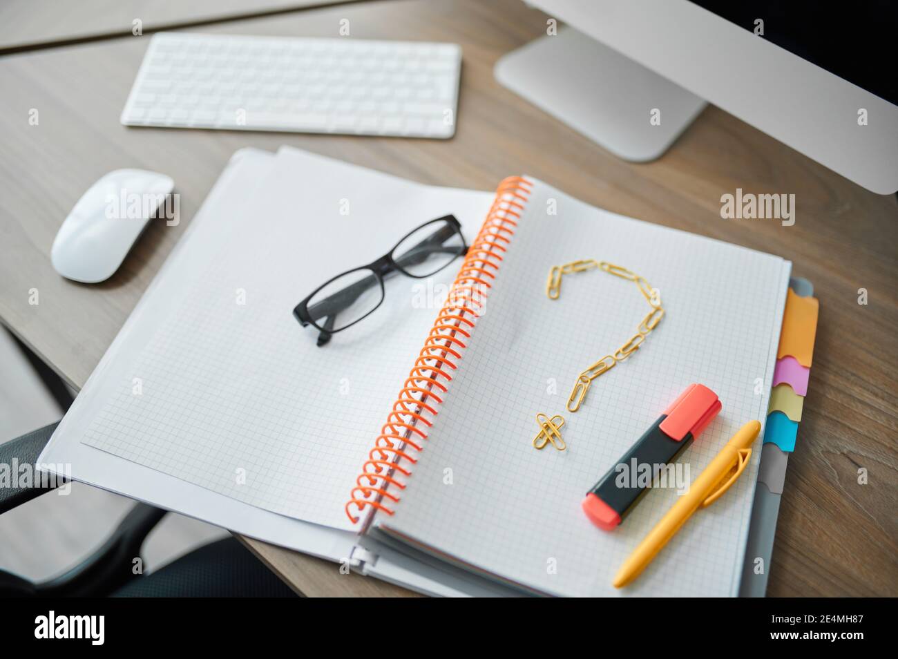 Notepad with a question mark, IT worker workplace Stock Photo - Alamy