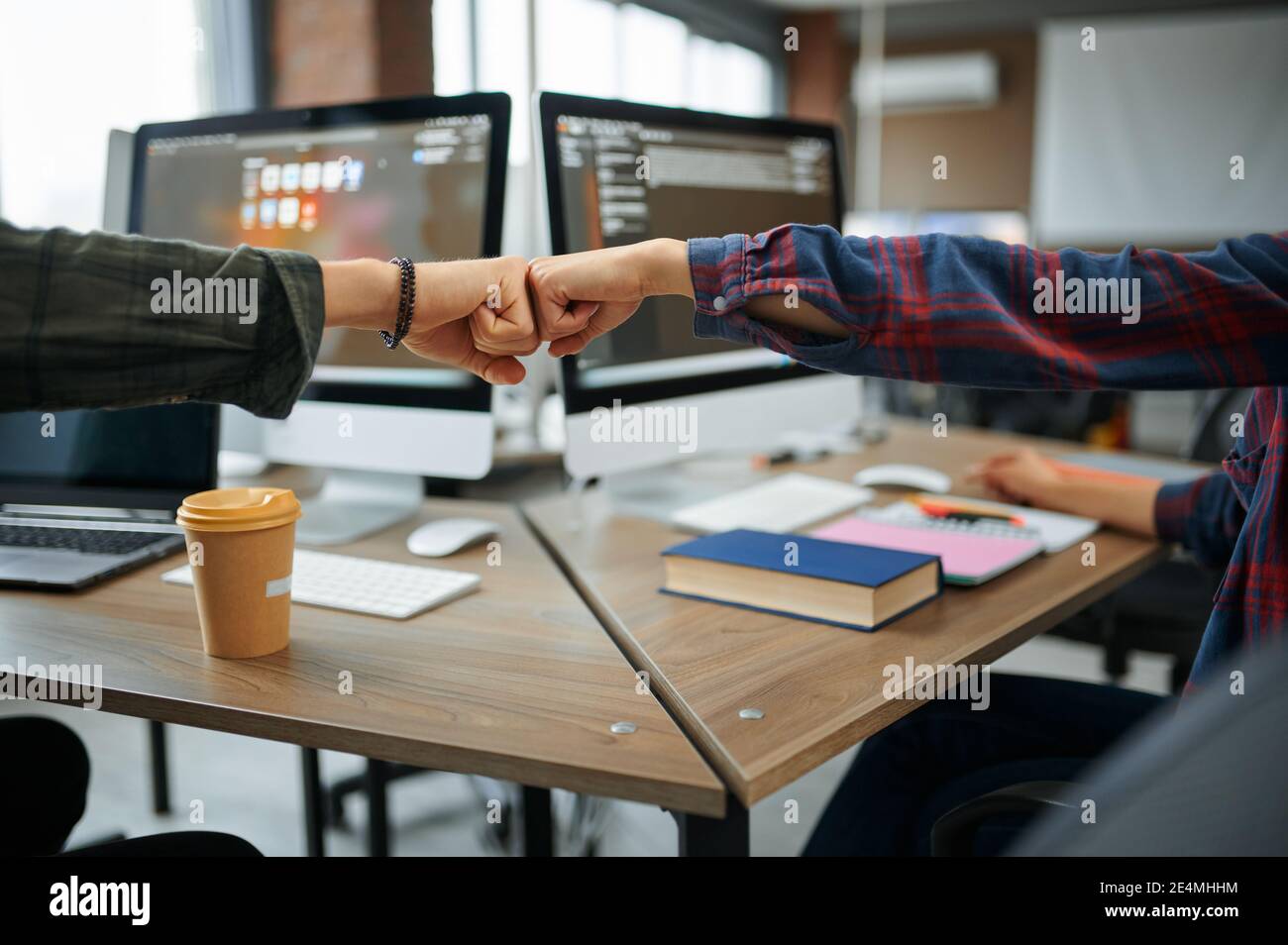 Two it specialists working in the office hi-res stock photography and ...