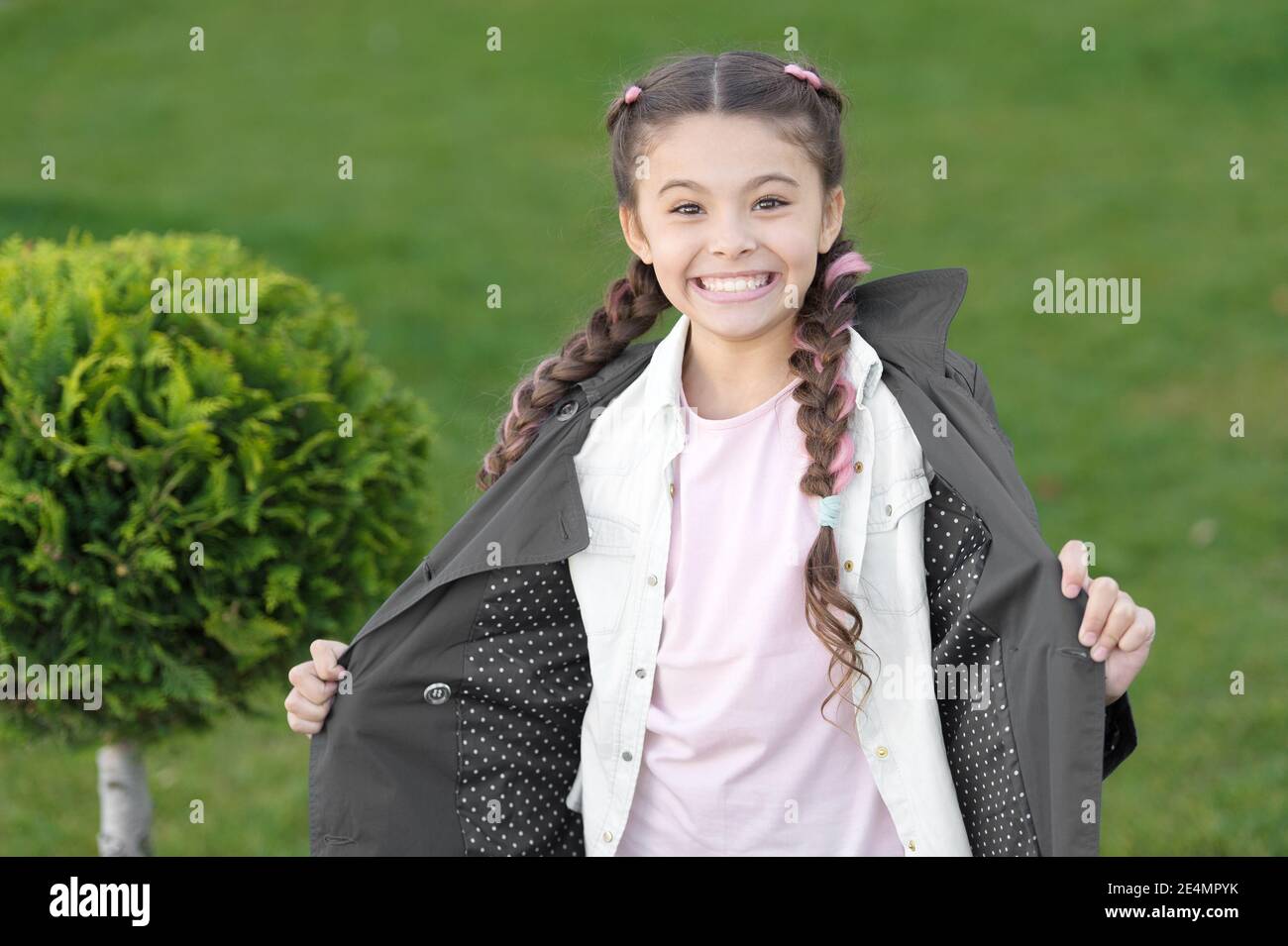 Good mood. Autumn weather. Cypress tree. Happy child with thuja ...