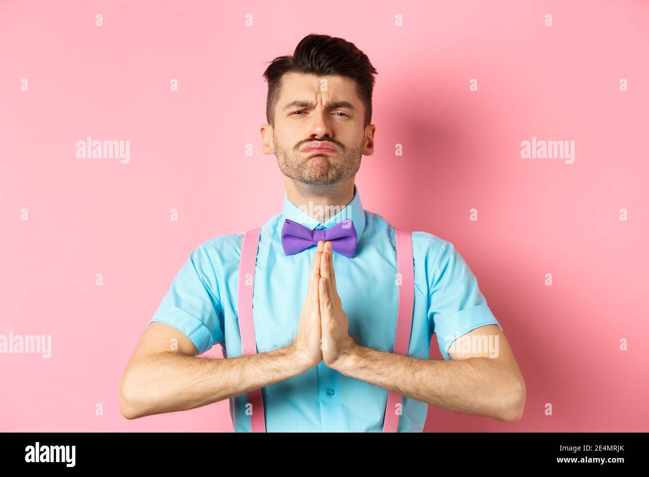 Silly guy making begging face, pleading and asking for help, standing ...