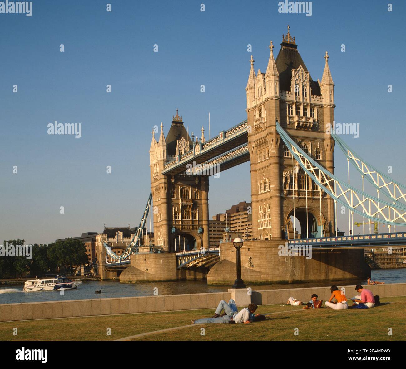 UK, England, London , Tower Bridge, People relaxing on the Green Stock ...