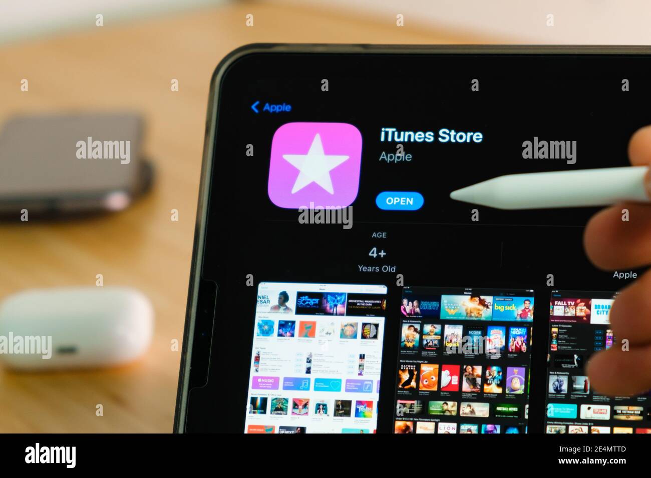 iTunes Store logo shown by apple pencil on the iPad Pro tablet screen ...