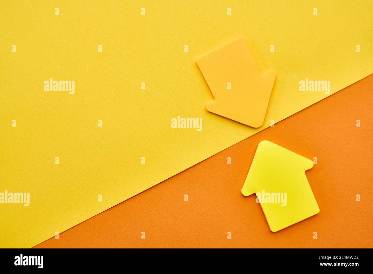 Yellow and orange magnetic arrows closeup Stock Photo - Alamy