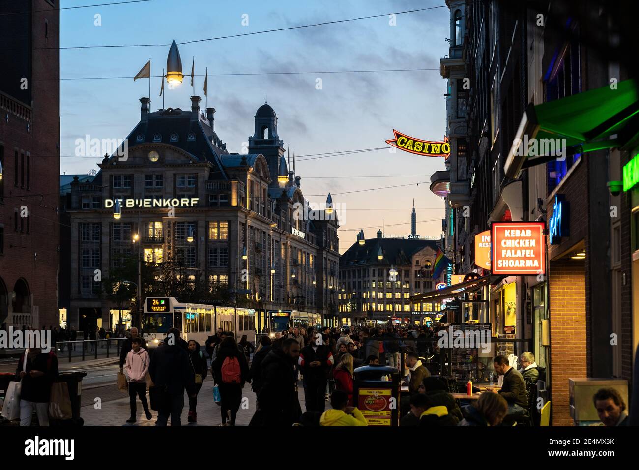Amsterdam street scene bustling pavement and tram lots of people at ...