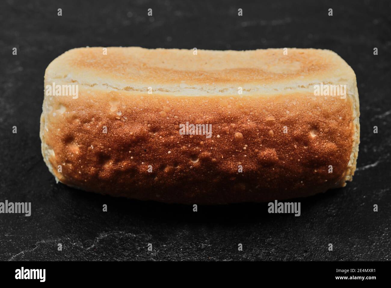 Square loaf of bread isolated on dark background Stock Photo - Alamy