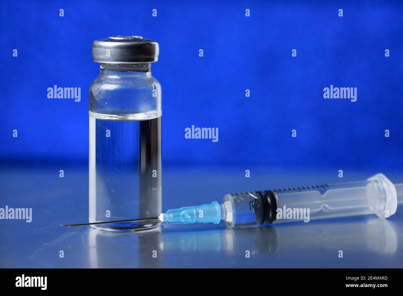 Medical ampoule for injection on blue. Medicine for vaccination Stock ...