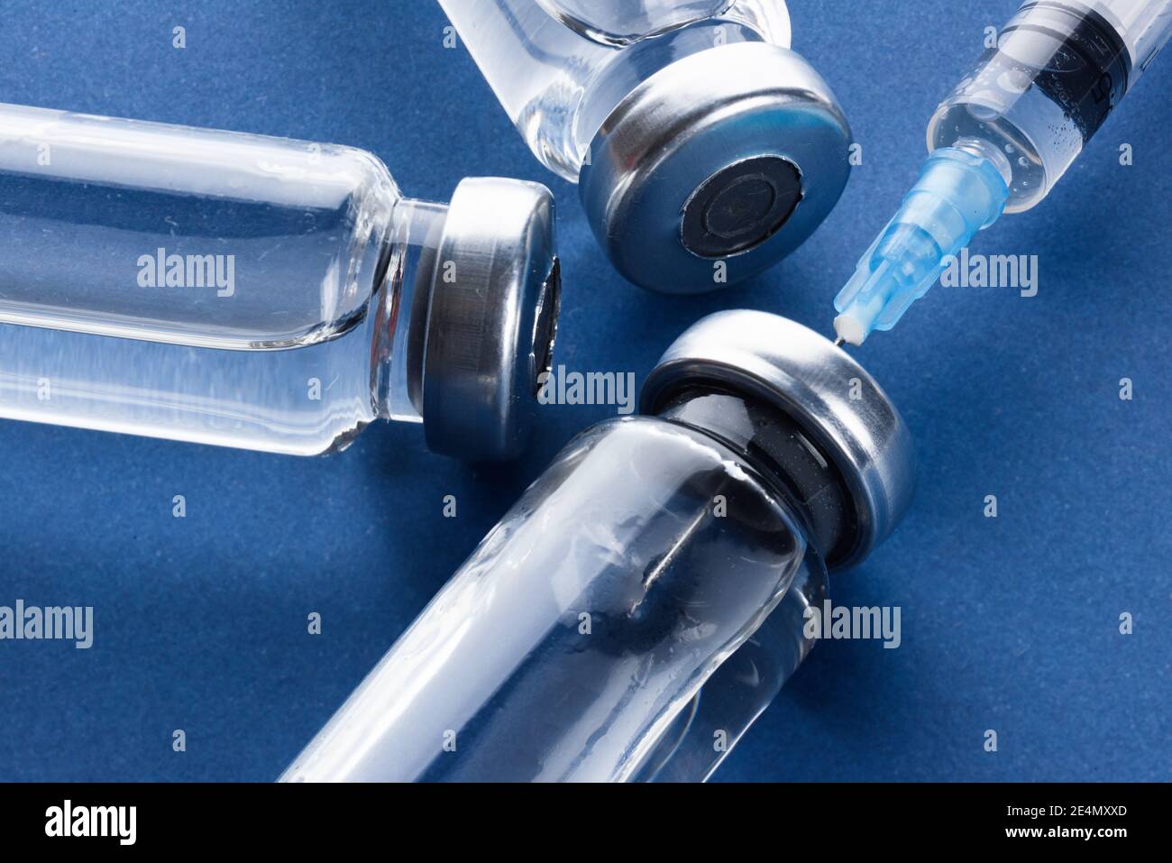 Medical ampoule for injection on blue. Medicine for vaccination Stock ...