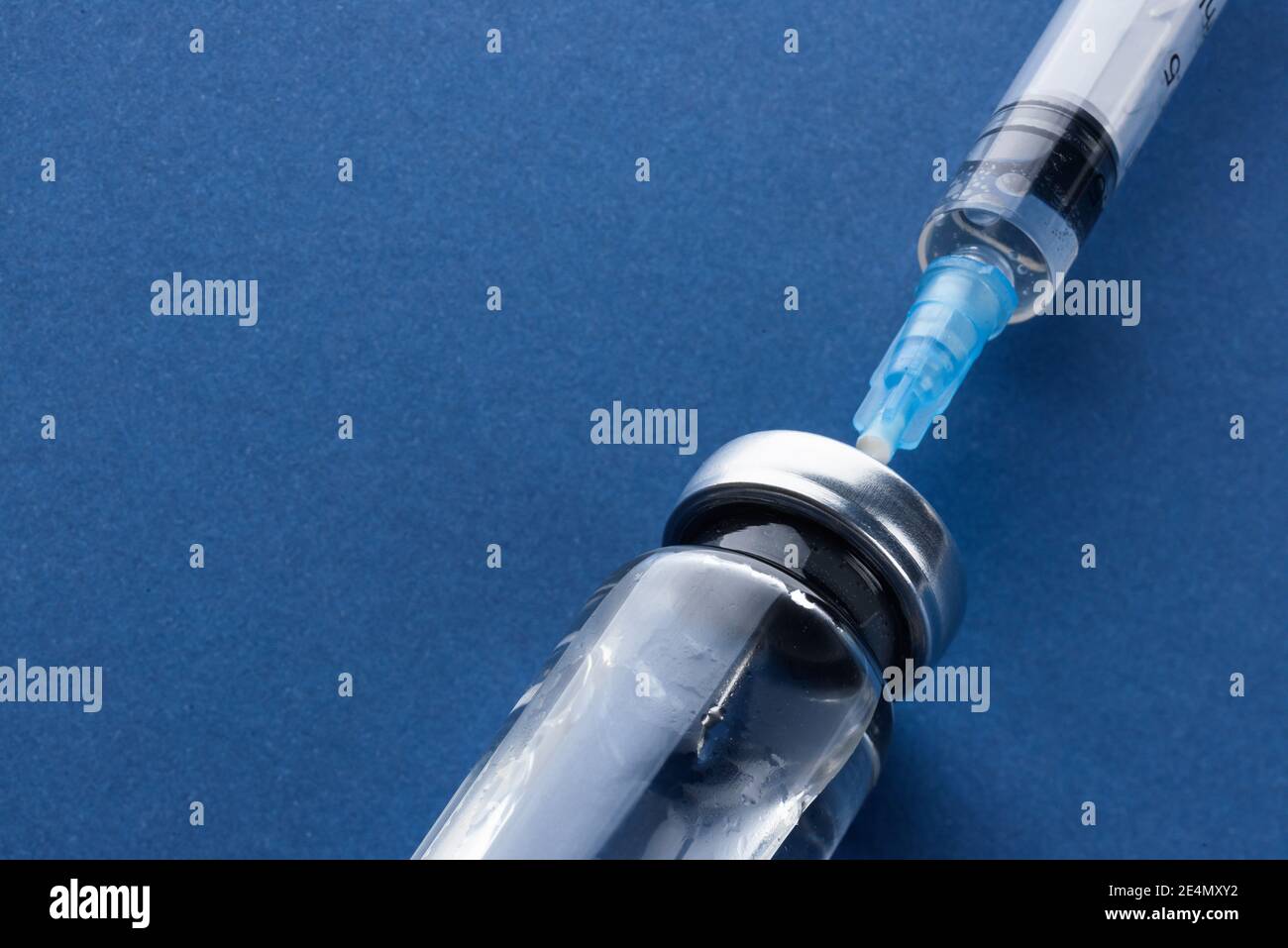 Medical ampoule for injection on blue. Medicine for vaccination Stock ...
