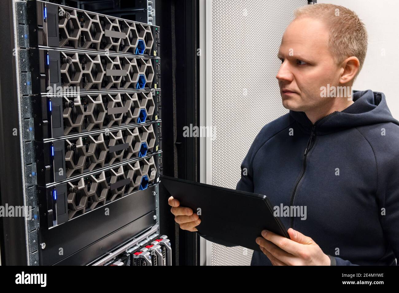 Male Computer Engineer With Digital Tablet Examining Hyperconverged ...