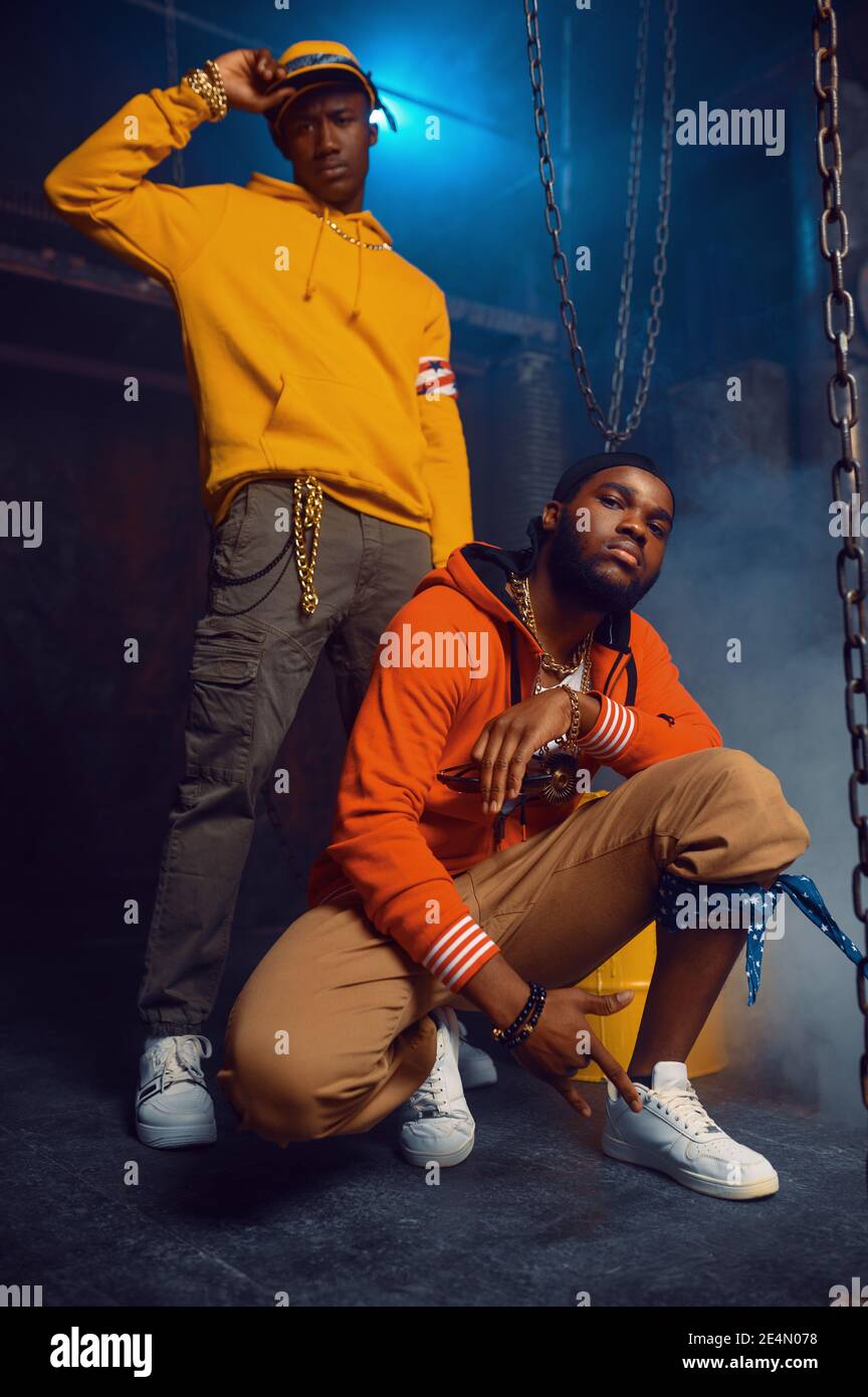 Two stylish rappers poses in studio Stock Photo - Alamy