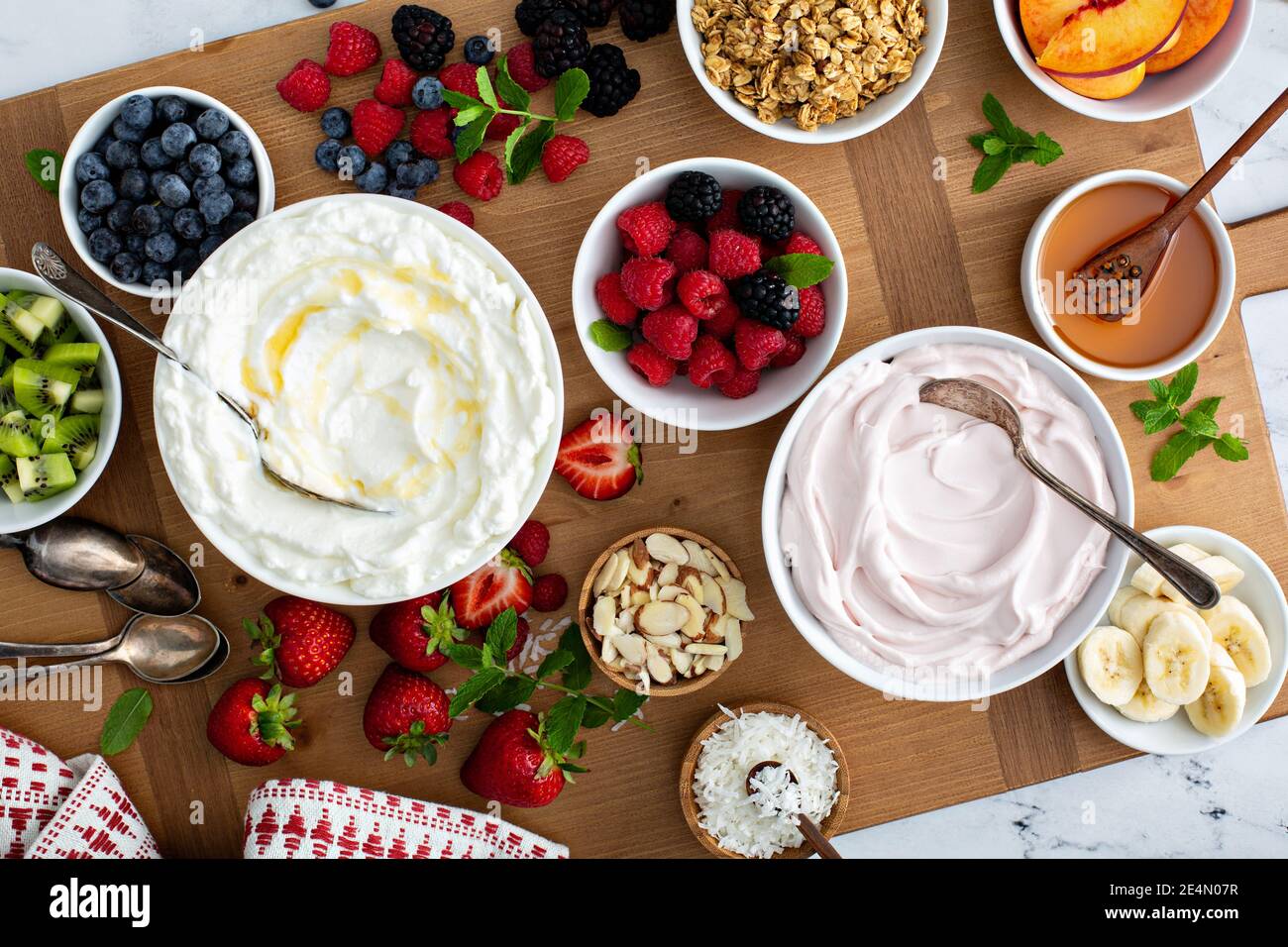 Yogurt bowl bar, big board with different toppings Stock Photo - Alamy