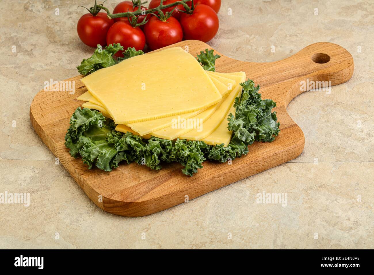 Sliced Gauda cheese snack over board Stock Photo - Alamy