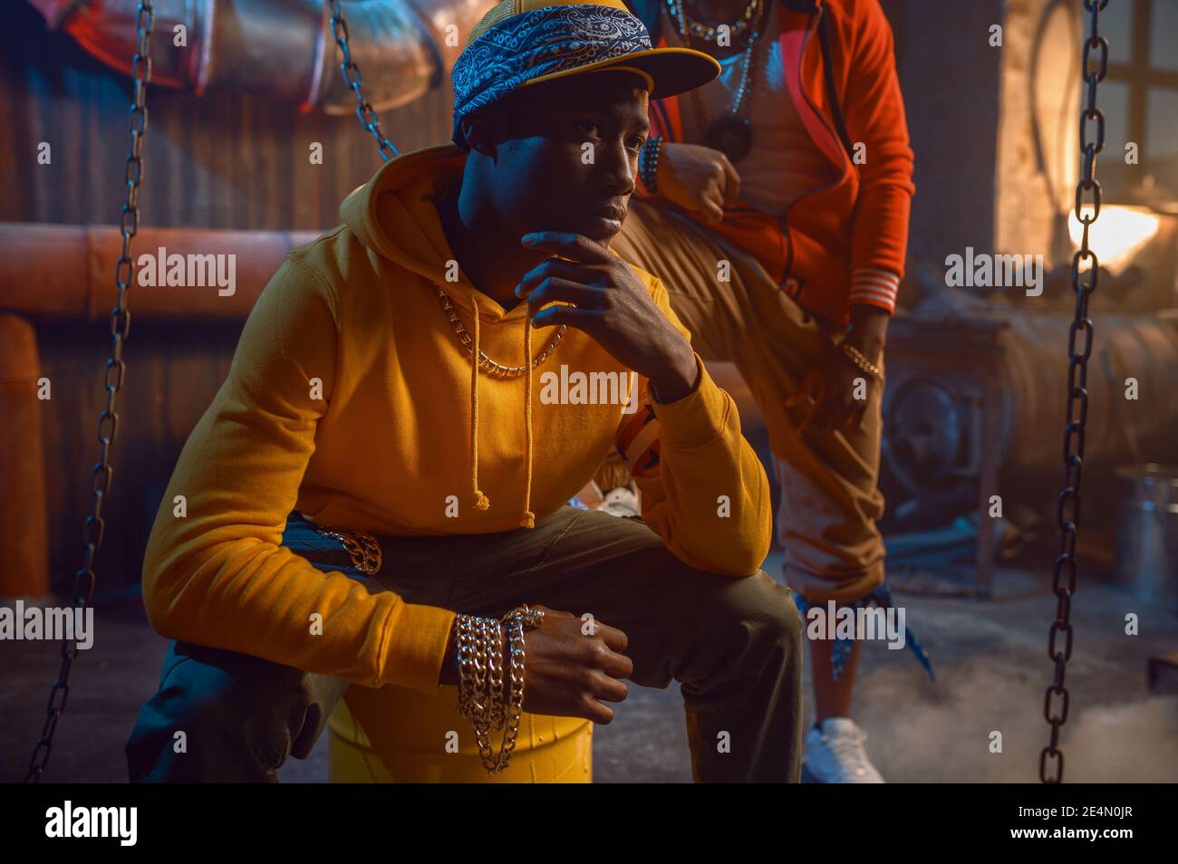 Two stylish rappers posing in studio Stock Photo - Alamy